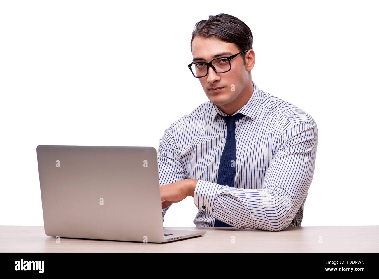 Handsome businessman working with laptop computer isolated on white ...