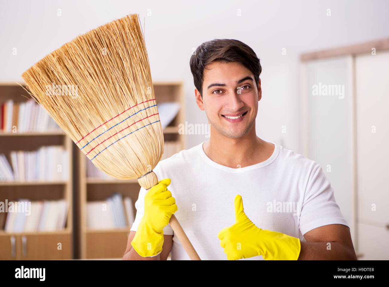 Husband sweeping hi-res stock photography and images - Alamy