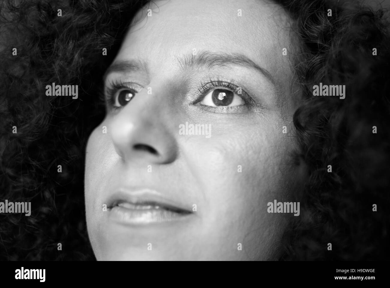 Face of a woman looking forward Stock Photo - Alamy