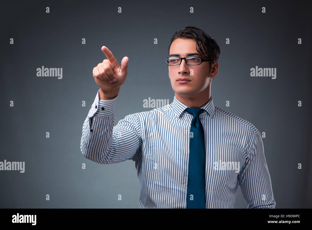 Handsome businessman pressing virtual buttons Stock Photo - Alamy Handsome businessman pressing virtual buttons Stock Photo - Alamy