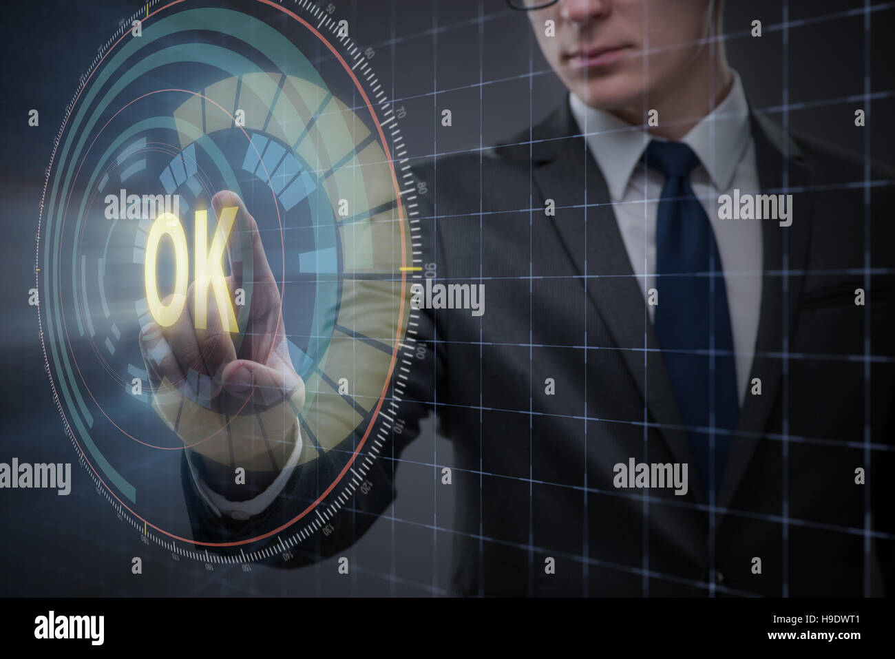 Businessman pressing virtual button OK Stock Photo - Alamy