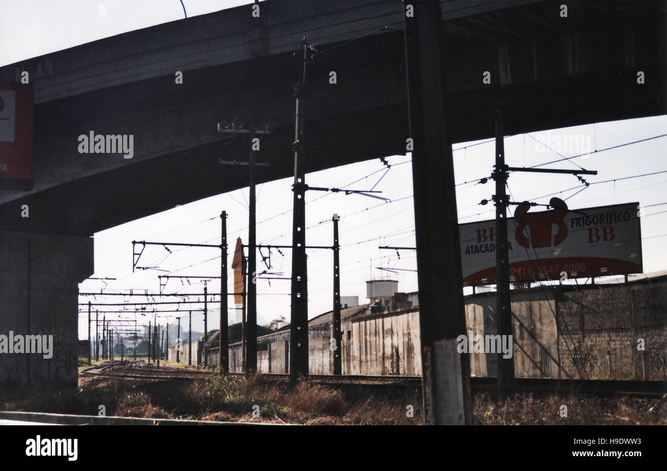 Rail train under a bridge Stock Photo - Alamy