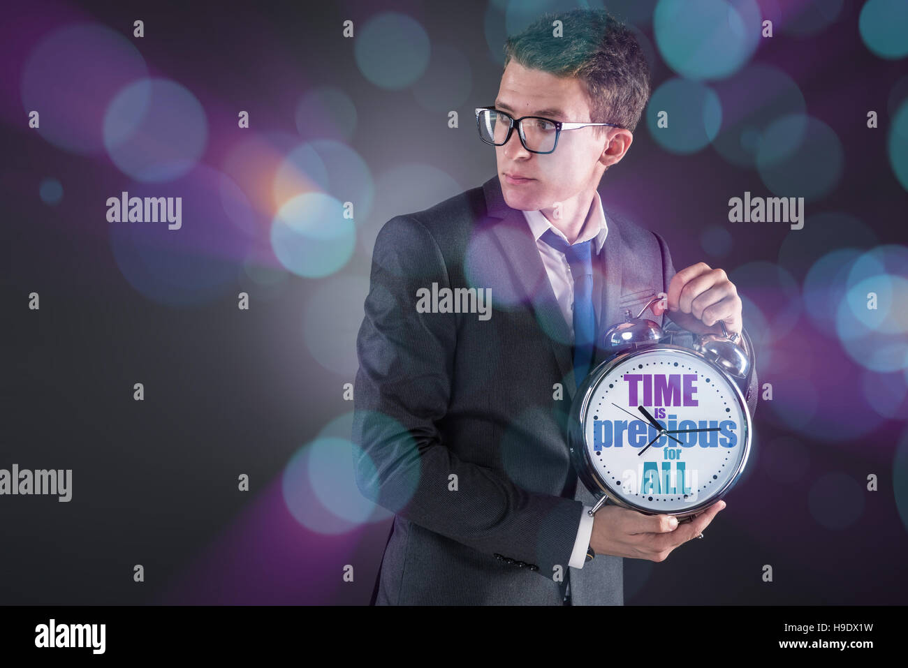 Young businessman time importance concept Stock Photo - Alamy