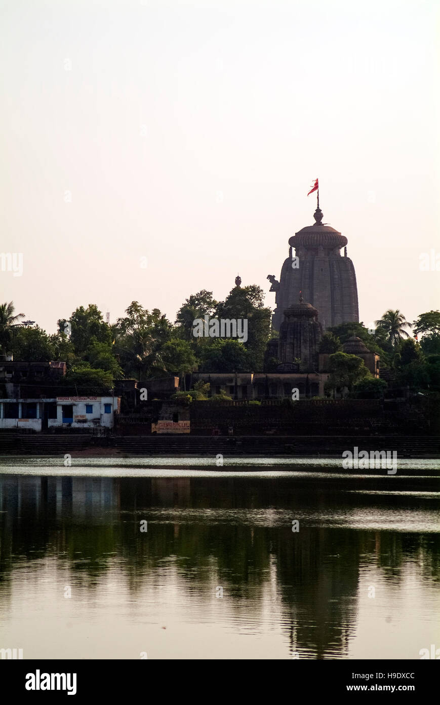 A temple tank with a temple tower or shikhara in the background in ...