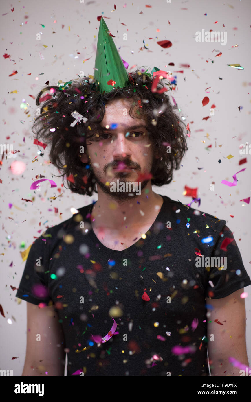 young man on party celebrating new year with falling confetti Stock ...