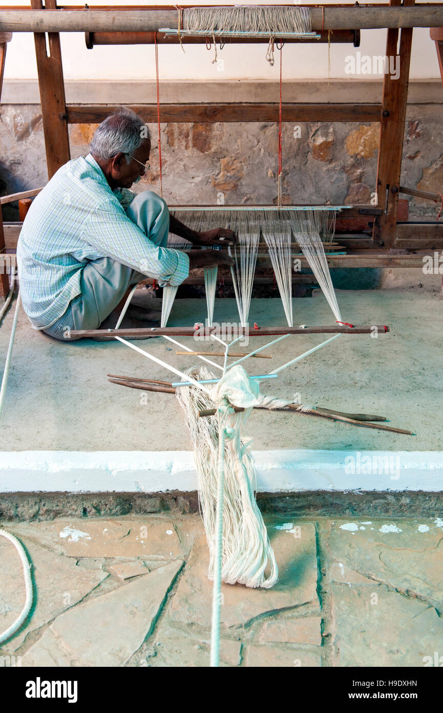 A man weaving at Khamir, a textile cooperative working to protect the ...