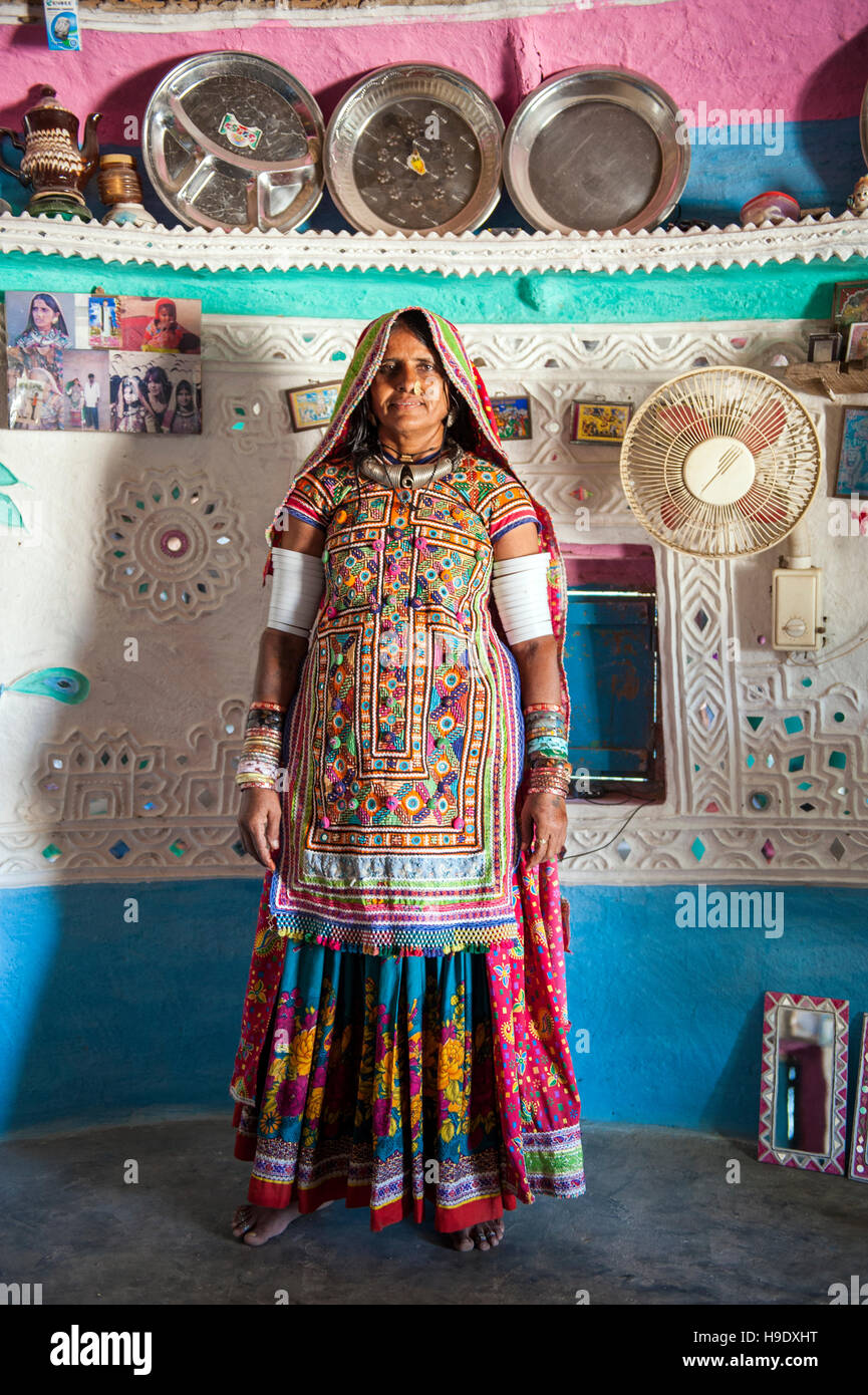 A Meghawal tribal woman standing inside of her family's ornately ...