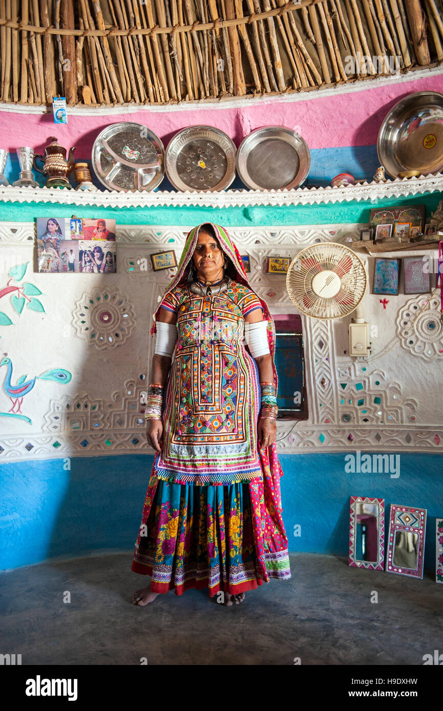 A Meghawal tribal woman standing inside of her family's ornately ...