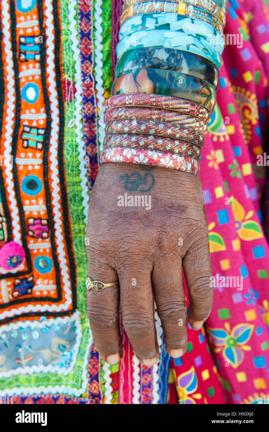 The hand of a Meghawal tribal woman in traditional dress in Hodka, a ...