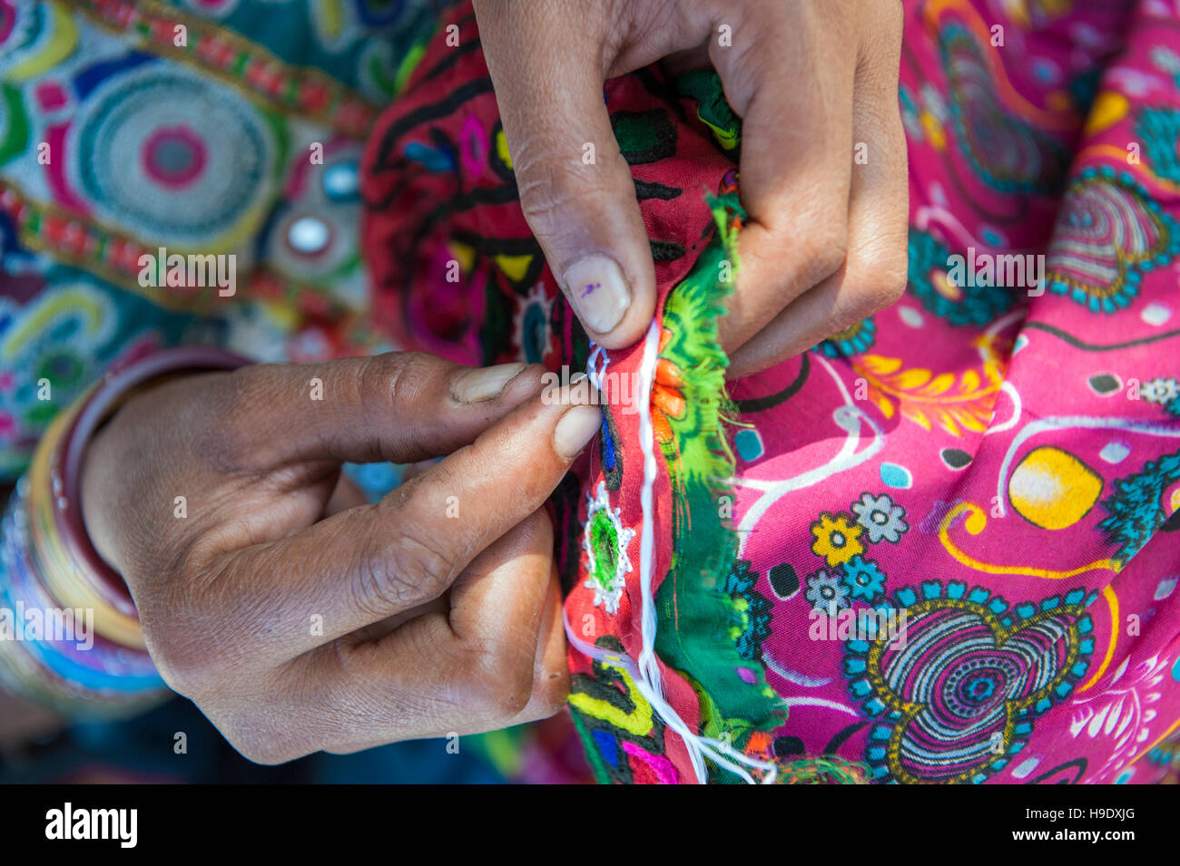A Meghawal tribal woman sweing in Hodka, a semi-arid region bordering ...