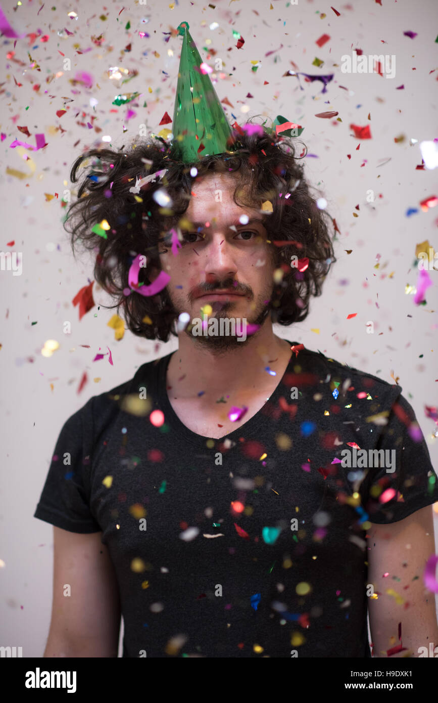 young man on party celebrating new year with falling confetti Stock ...