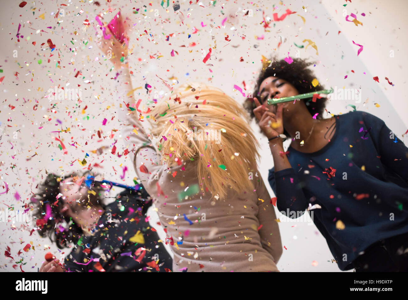 confetti party happy young people group celebrating new year eve while ...