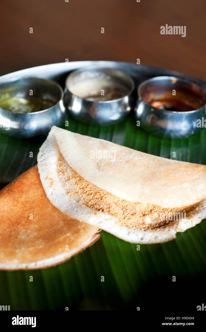 A plate of dosa, a pancake of fermented rice and black lentils served ...