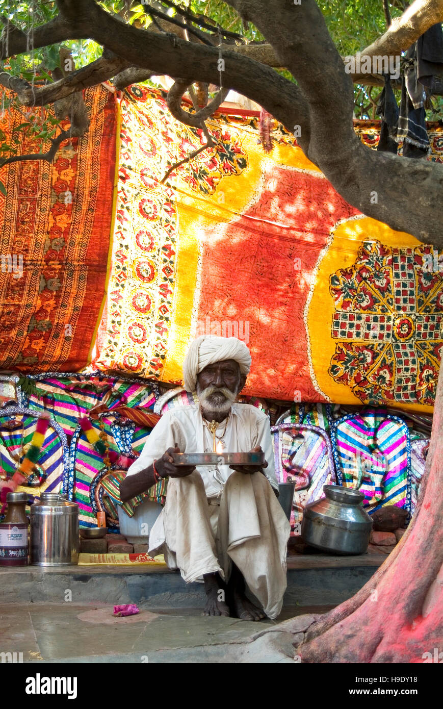 A snake charmer and local holy man in a village outside of Bhenswara, a ...