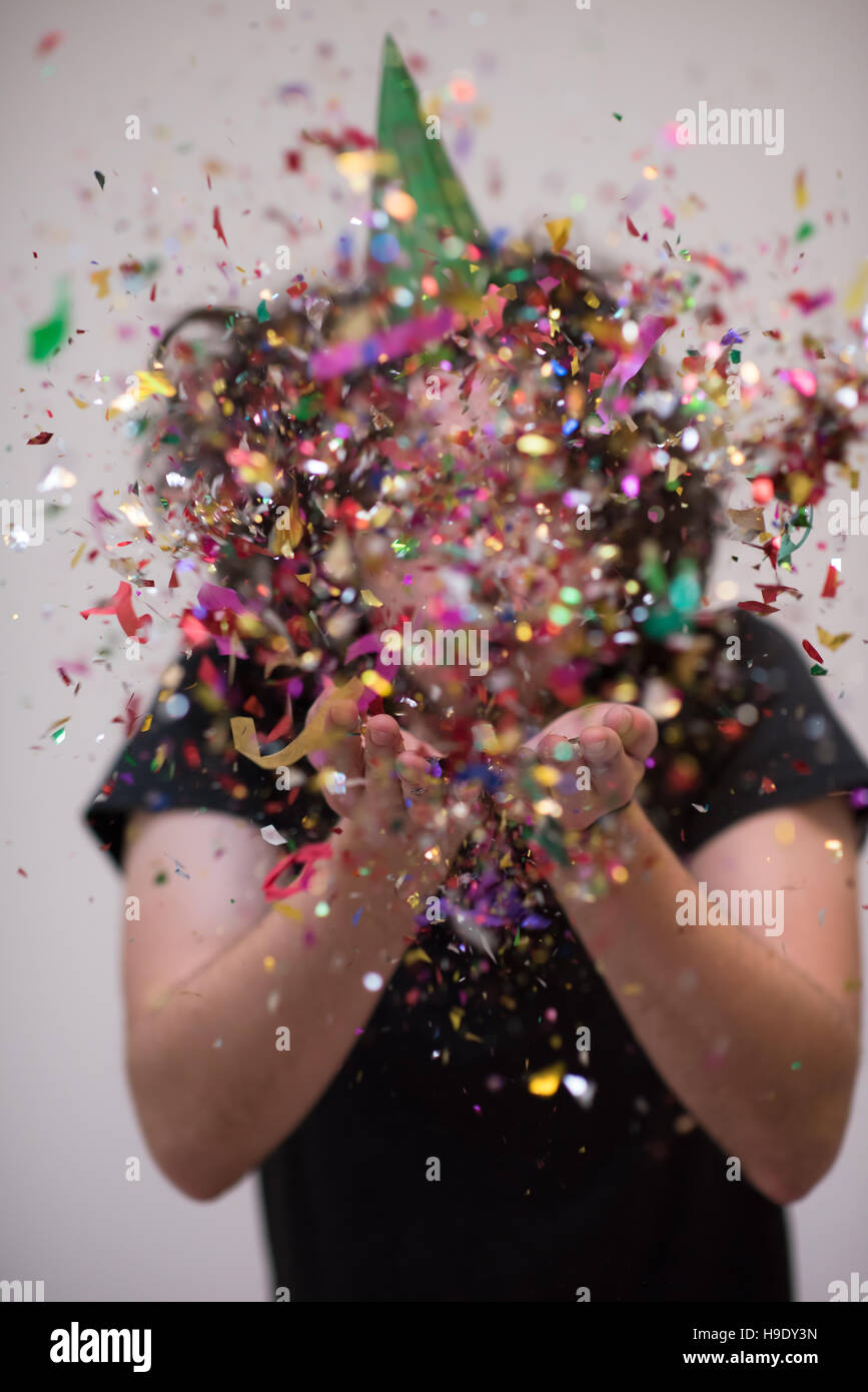 young man on party celebrating new year with falling confetti Stock ...