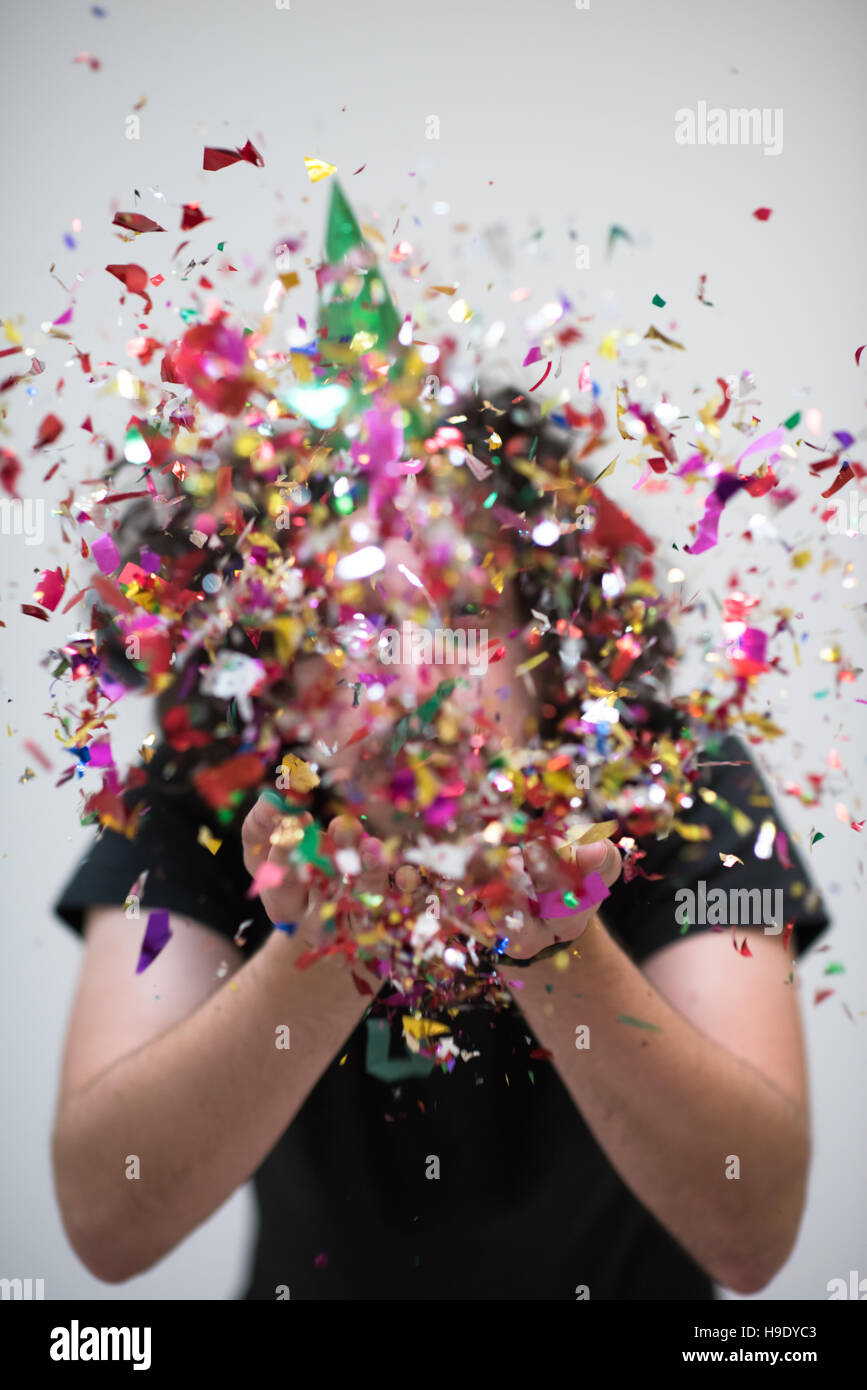 young man on party celebrating new year with falling confetti Stock ...