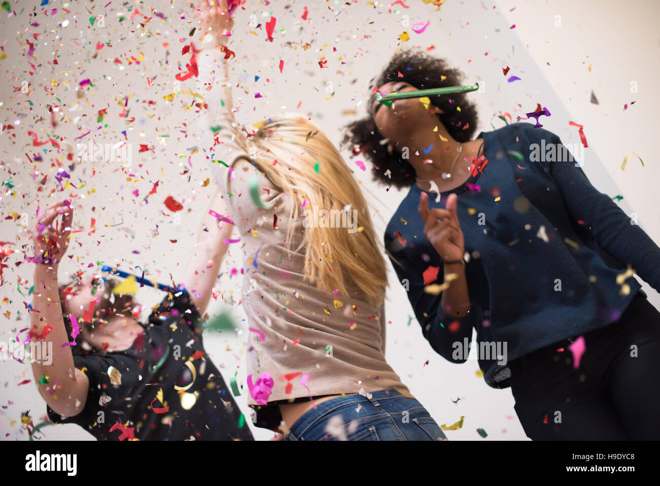 confetti party happy young people group celebrating new year eve while ...