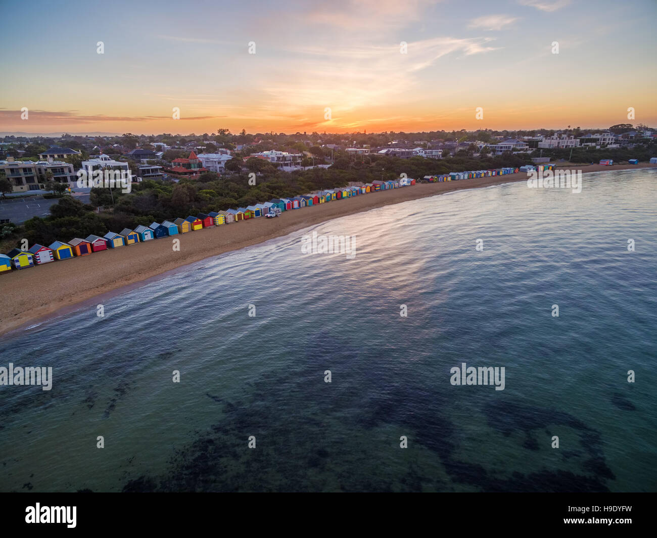 Aerial view of sunrise at Brighton Beach showing the suburb and bathing ...