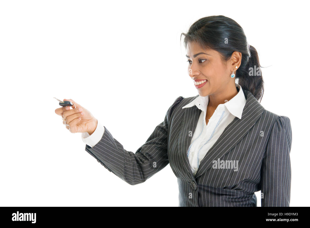 Female Indian car dealer hand over vehicle key to client, isolated on ...