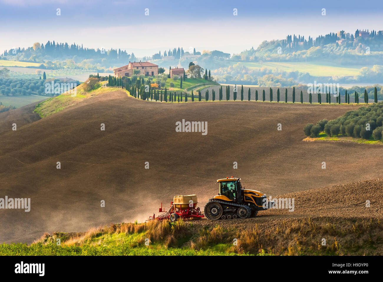 Rural landscape with tractor operating on the field, farmland Stock ...
