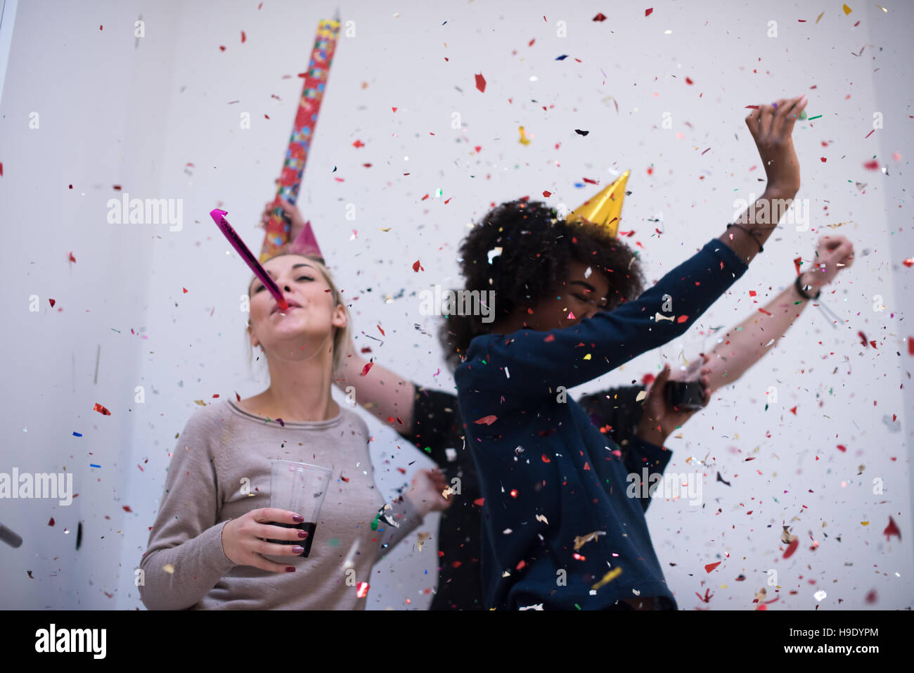 confetti party happy young people group celebrating new year eve while ...