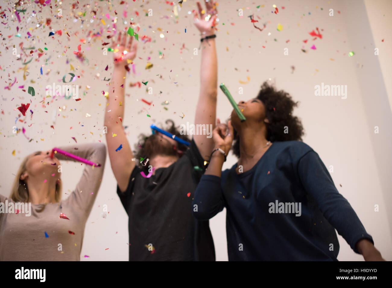 confetti party happy young people group celebrating new year eve while ...