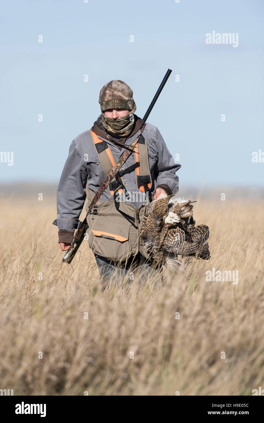 A hunter with a Prairie Grouse Stock Photo - Alamy