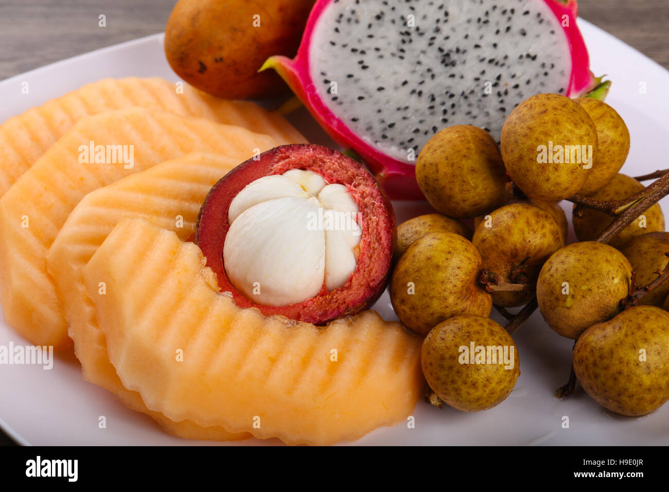 Tropical fruit mix - melon, longan, mangosteen, dragonfruit Stock Photo ...