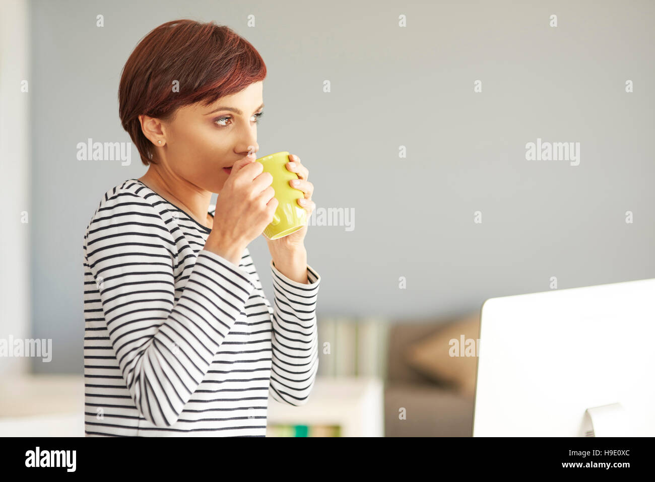 Woman drinking cup of good coffee Stock Photo - Alamy
