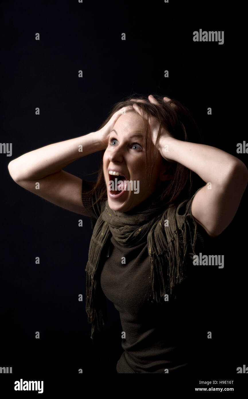 Young woman in panic Stock Photo - Alamy