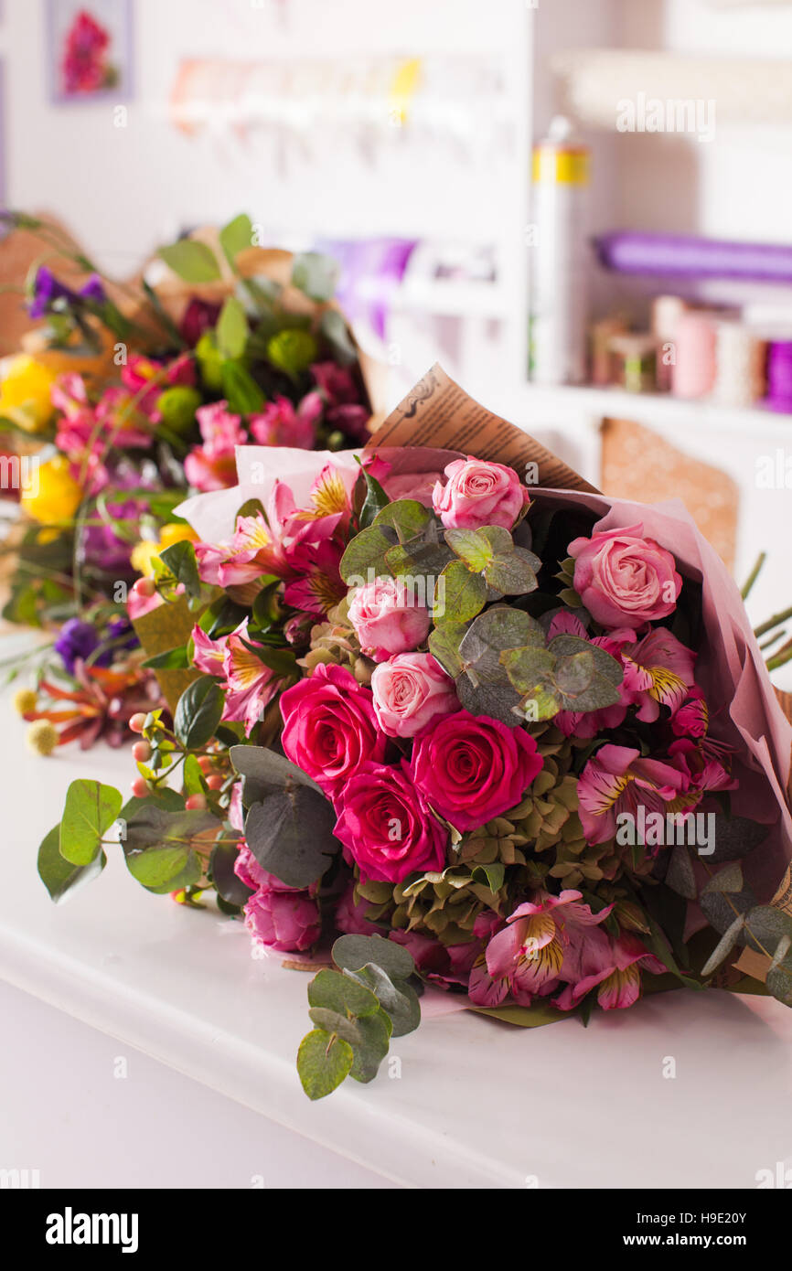 Finished bouquets on the table Stock Photo - Alamy