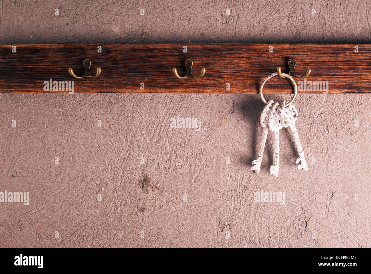 Keys on hooks Stock Photo - Alamy