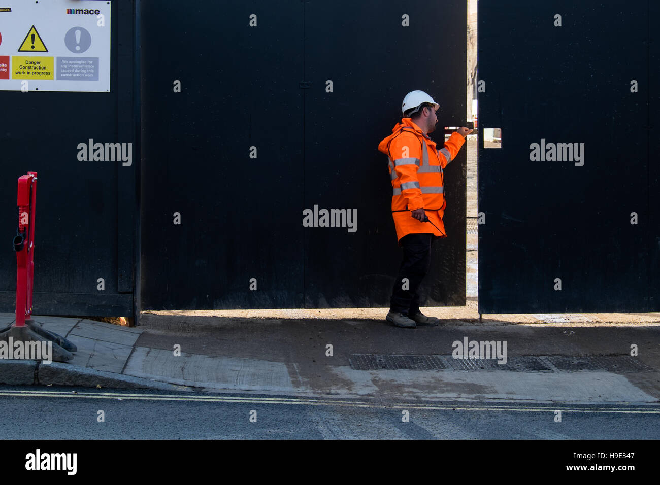 Groundsmen construction site workers in high visibility jackets on a ...