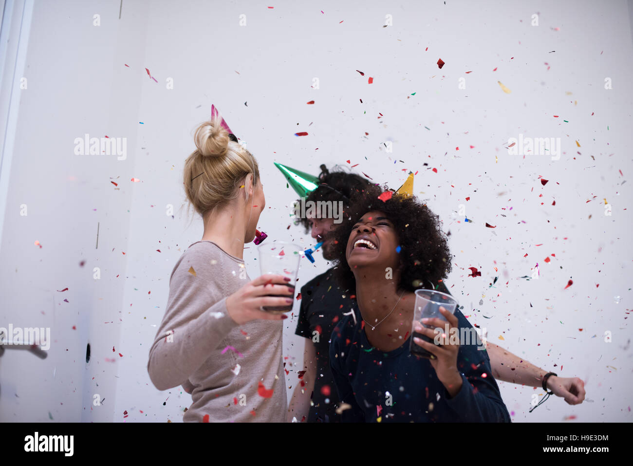 confetti party happy young people group celebrating new year eve while ...