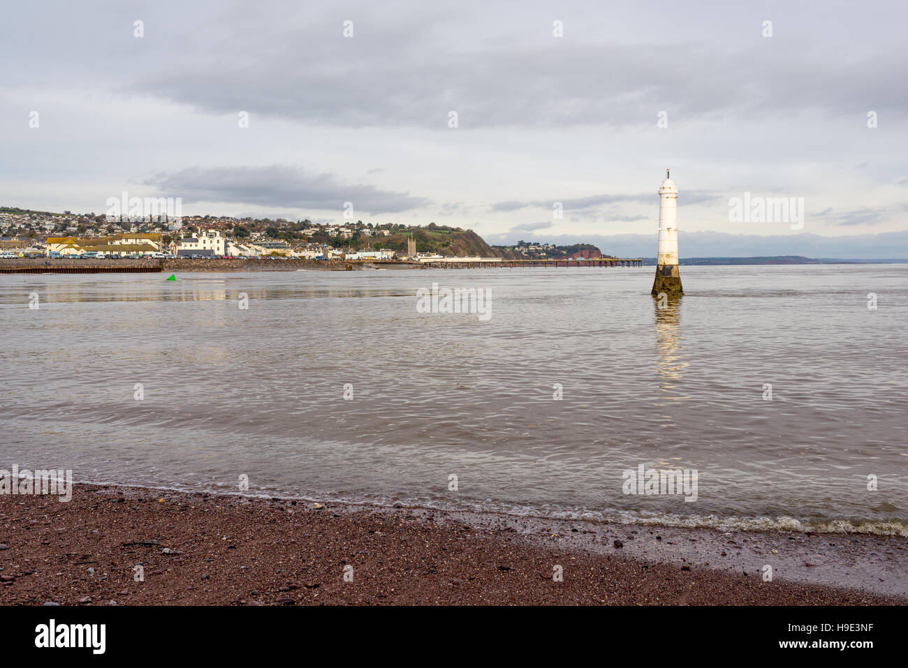 A small lighthouse marks the entrance to the Teign River estuary at ...