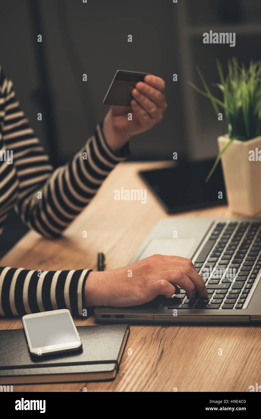 Laptop computer shopping online from office, businesswoman using debit ...