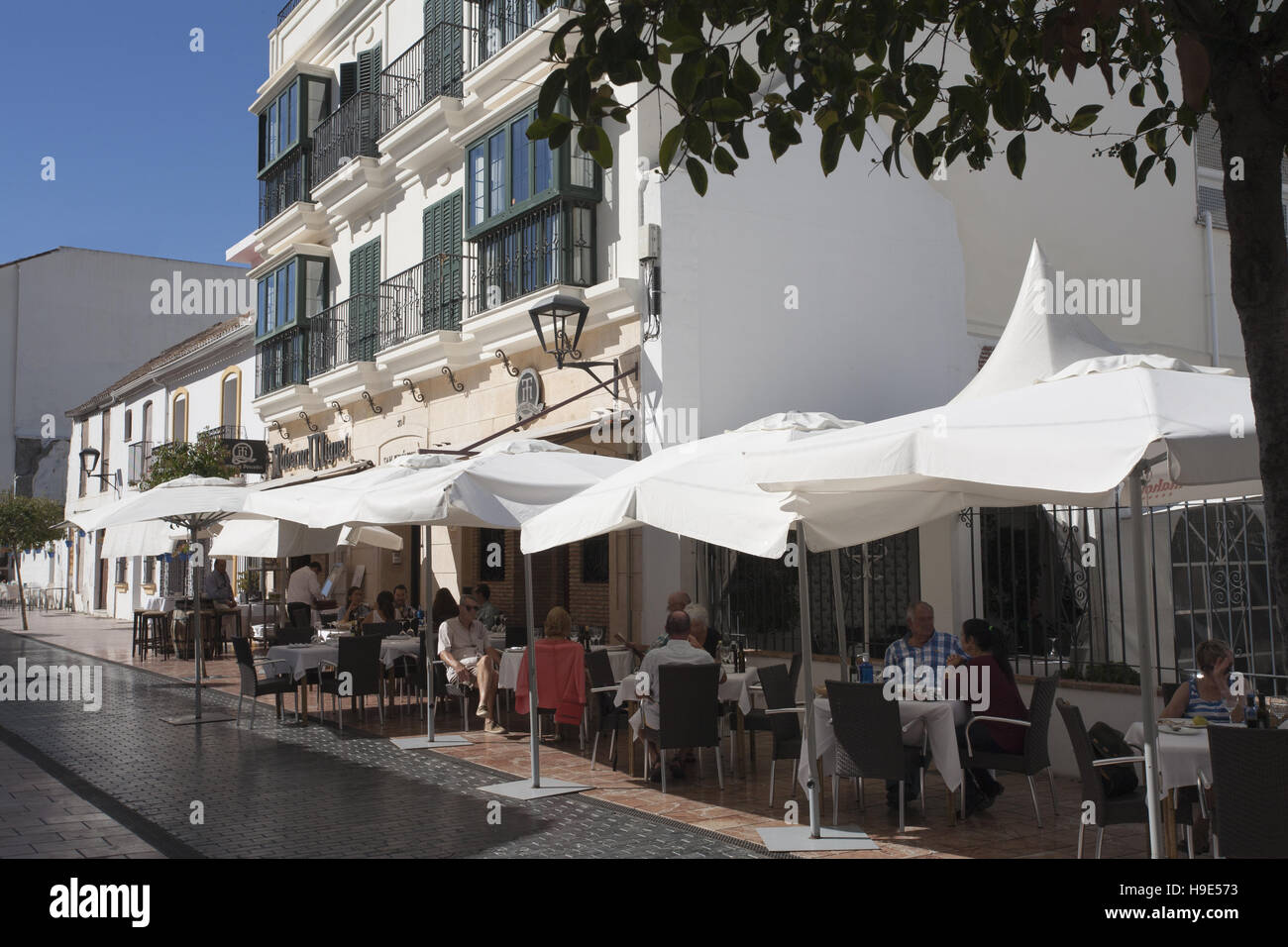 Mediterranean street scene. Costa del Sol. Spanish sidewalk cafe Stock ...