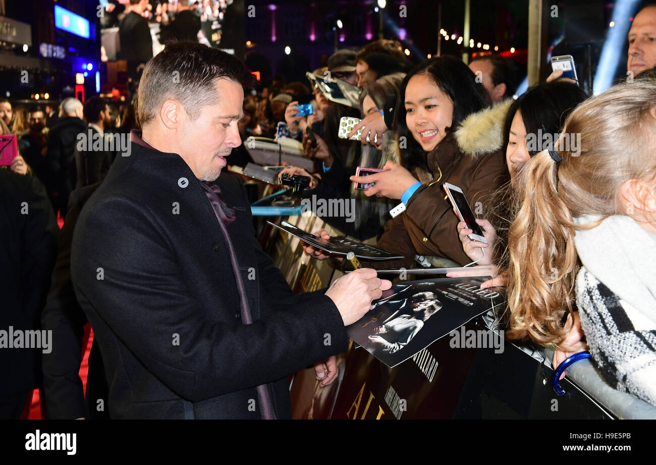Brad Pitt signs autographs whilst attending the 'Allied' UK Premiere at ...