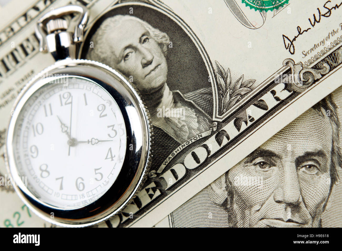 Watch and American banknotes. Time is money idea Stock Photo - Alamy