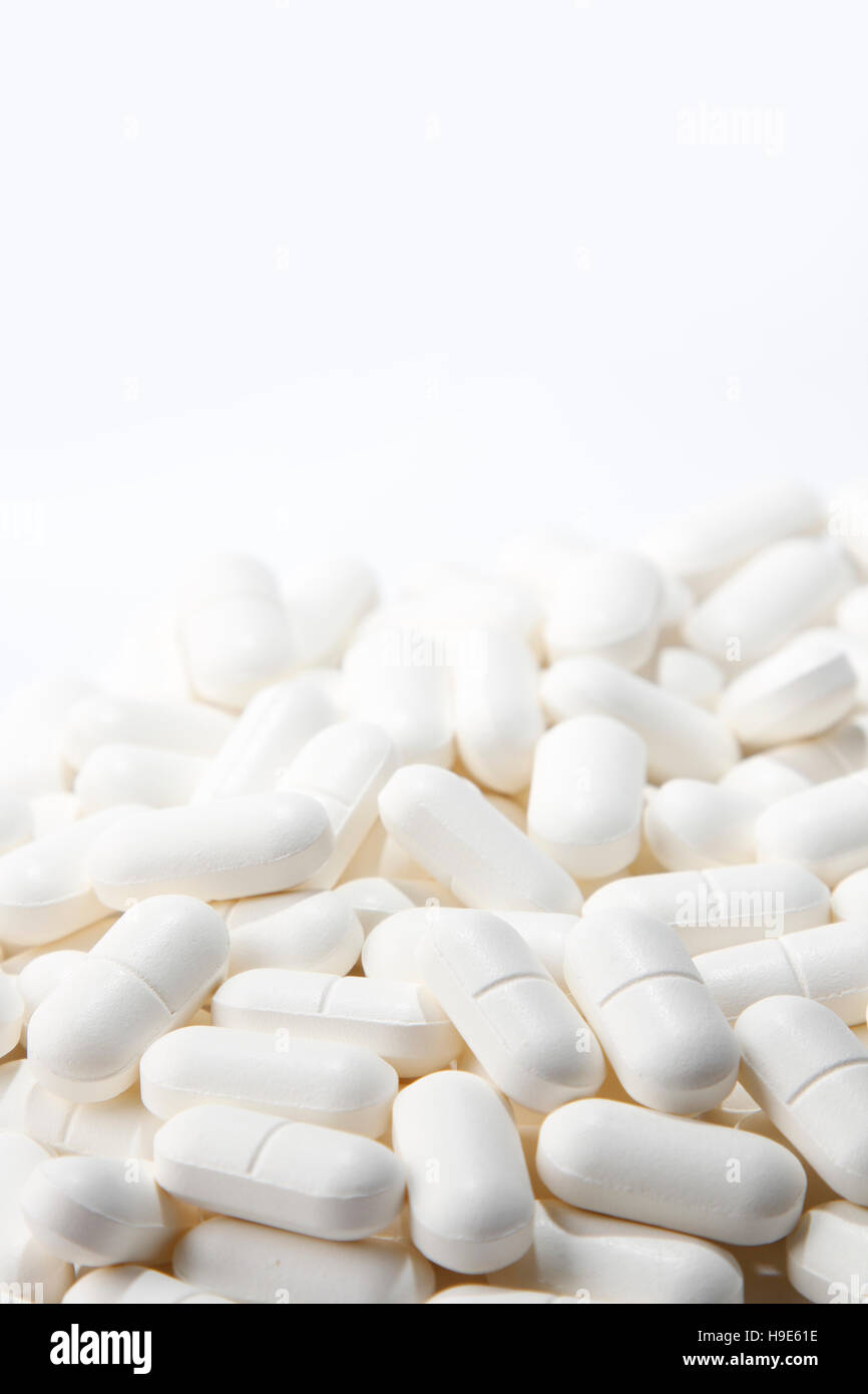Pile of tablets closeup, copy space Stock Photo - Alamy
