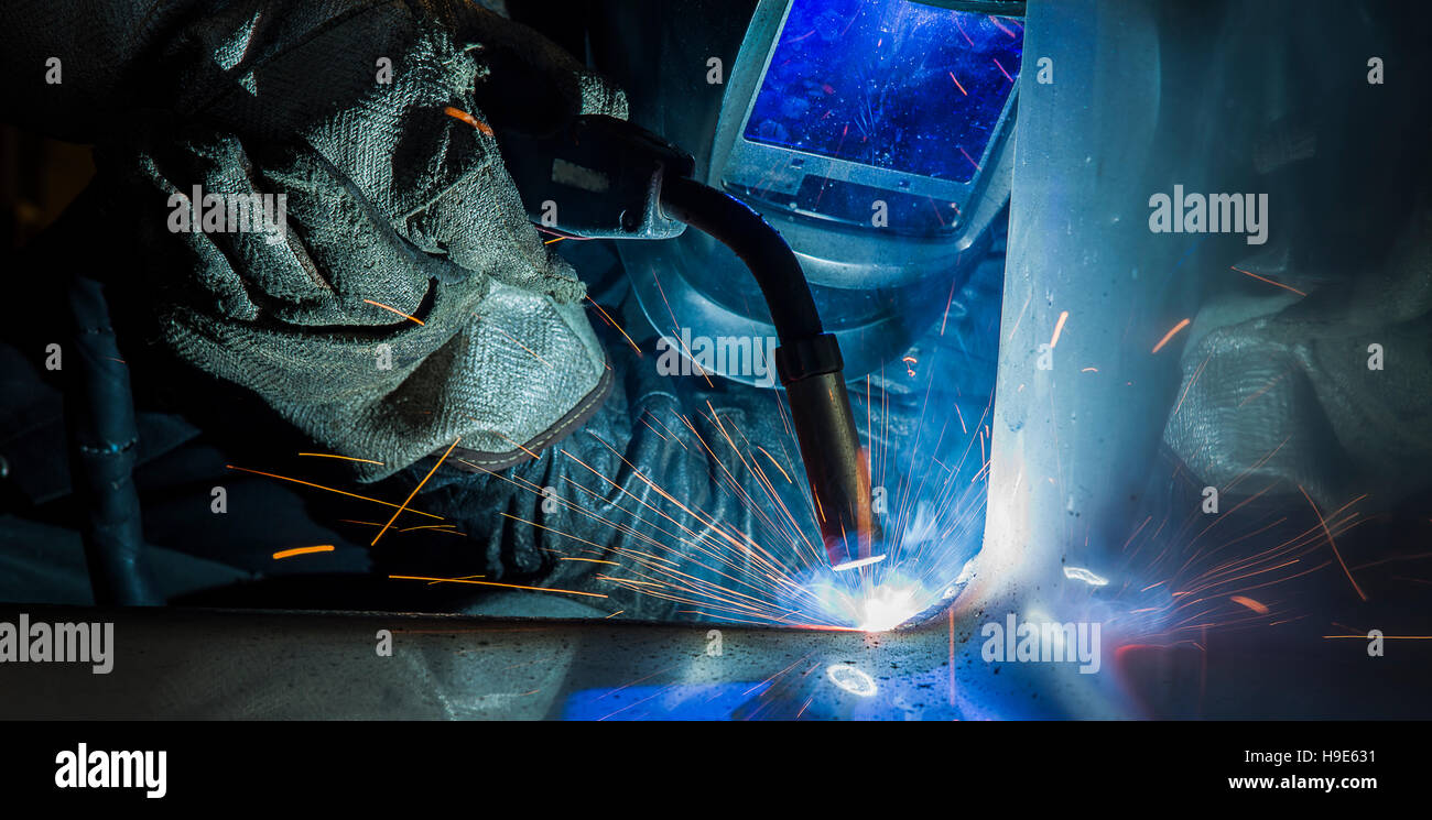 welder Industrial automotive part in factory Welder at work welding ...