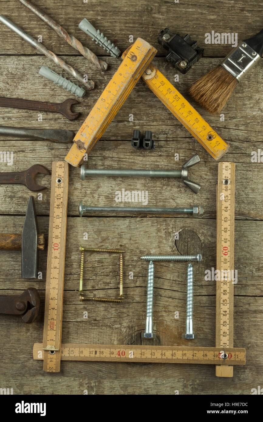 Plans to build a house. Rustic wooden background. Tools for builders ...