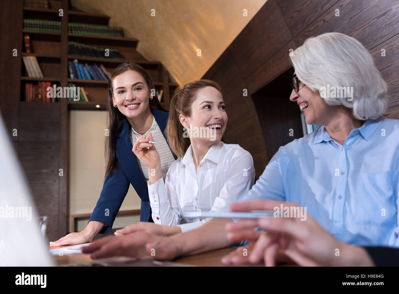 Three delighted colleagues doing their job together Stock Photo - Alamy