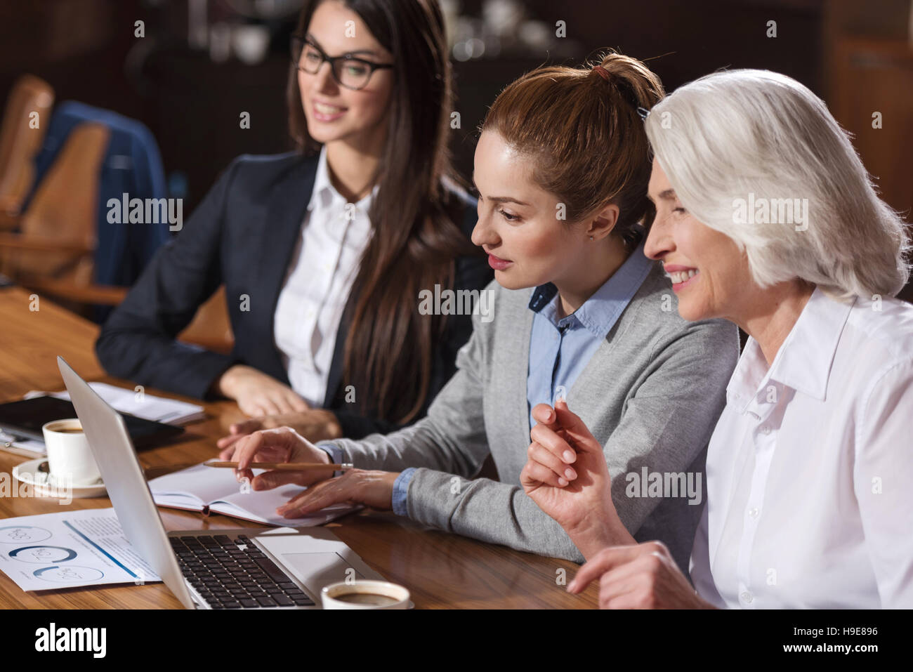 Three colleagues concentrating on work in an office Stock Photo - Alamy