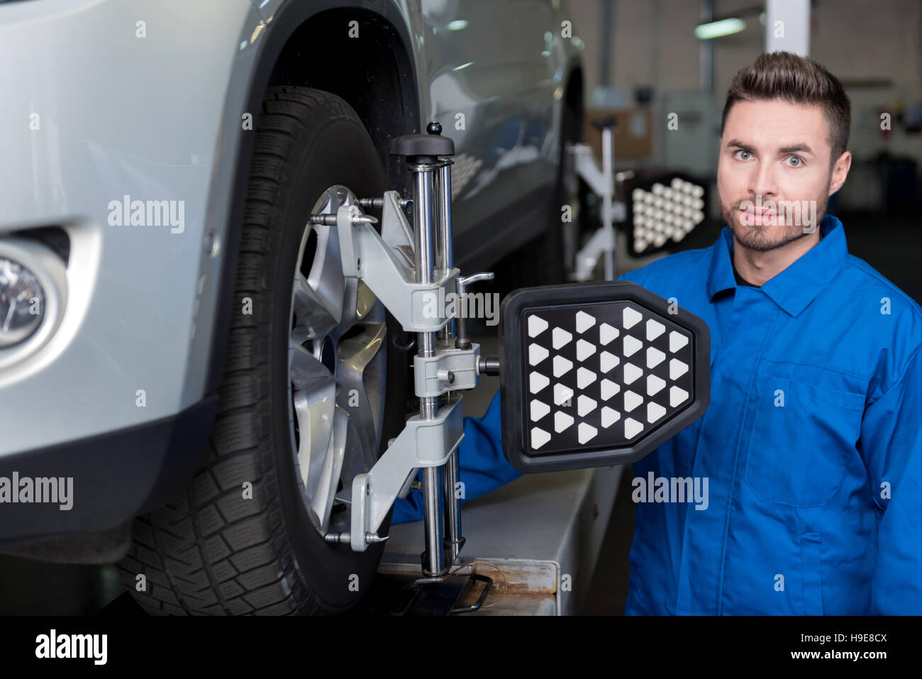 Professional mechanic checking car Stock Photo - Alamy