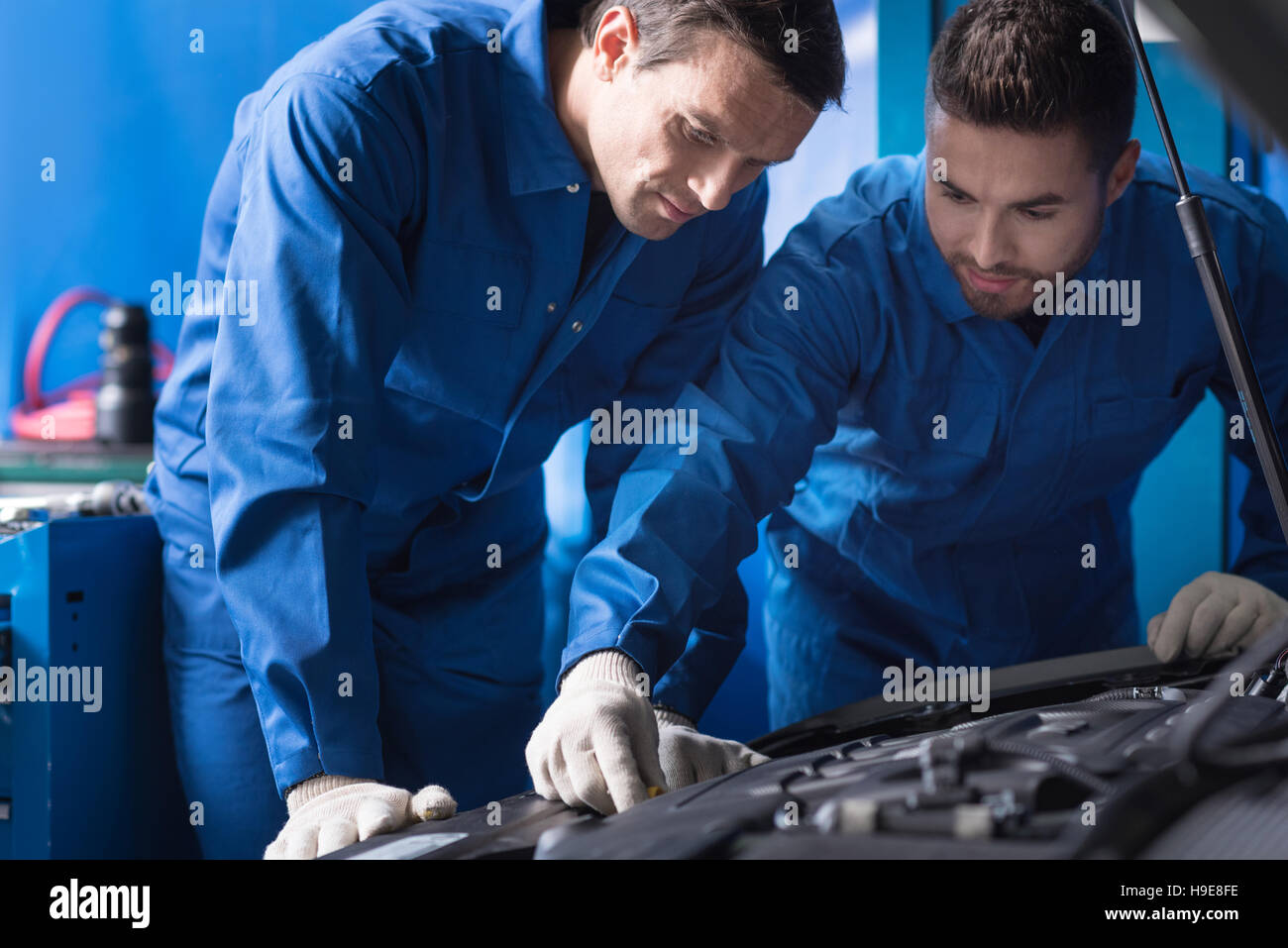 Mechanics working on car hi-res stock photography and images - Alamy
