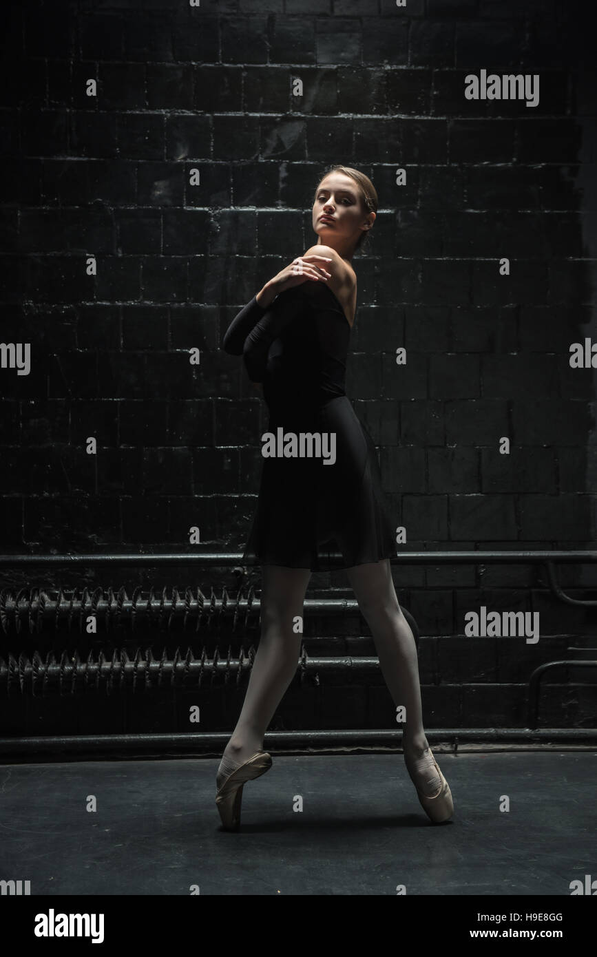 Serious dancer standing on tiptoe Stock Photo - Alamy