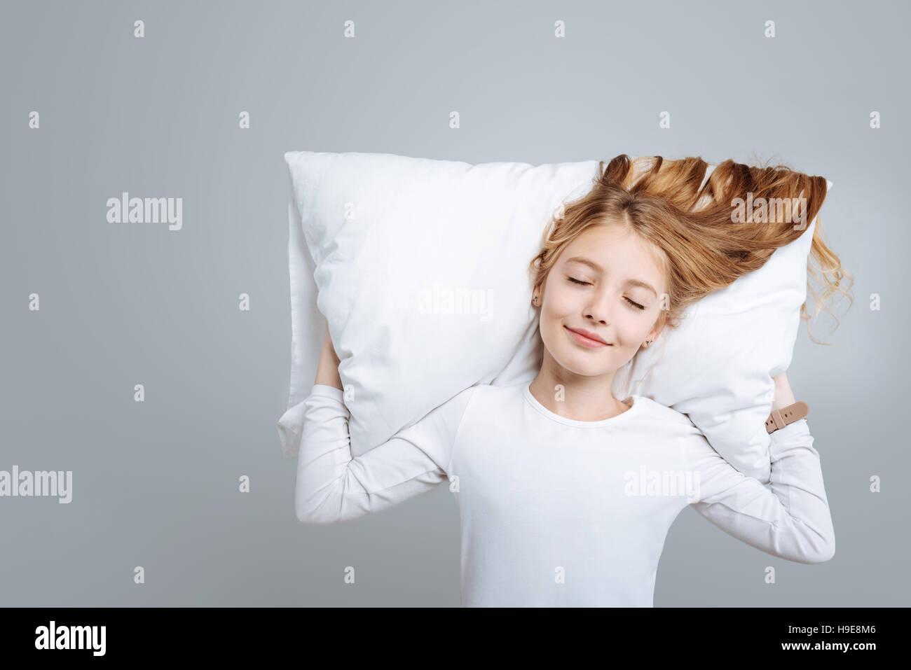 Delighted cute girl sleeping Stock Photo - Alamy