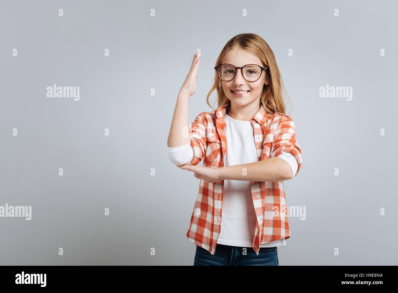 Positive little girl learning at school Stock Photo - Alamy
