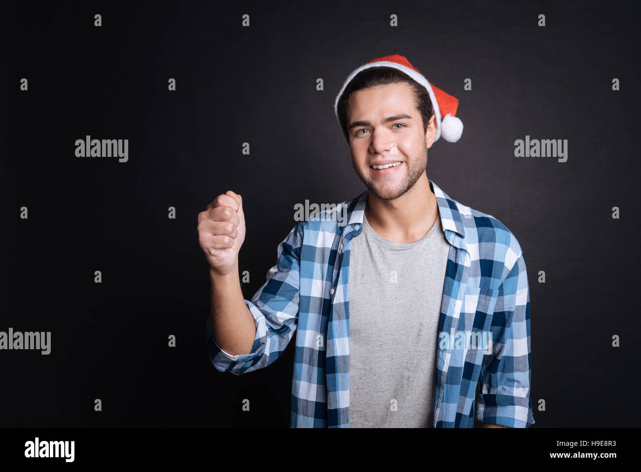 Positive man holding bell Stock Photo - Alamy